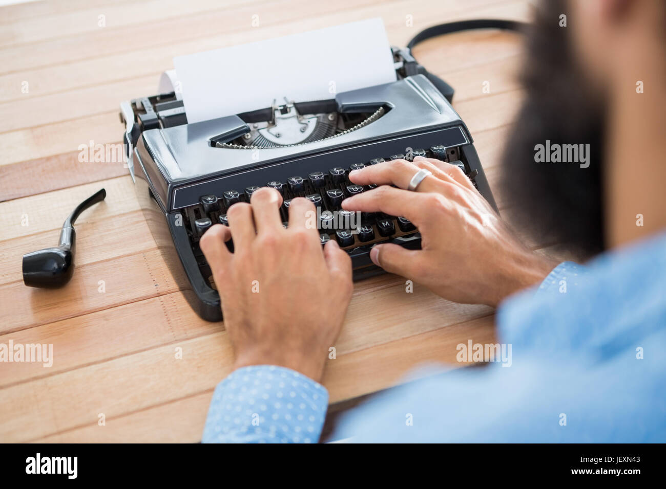 Hipster using type writer Stock Photo - Alamy