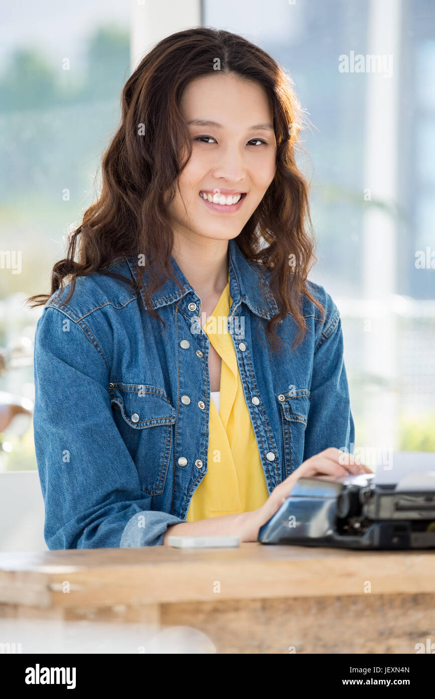 Hipster using type writer Stock Photo - Alamy