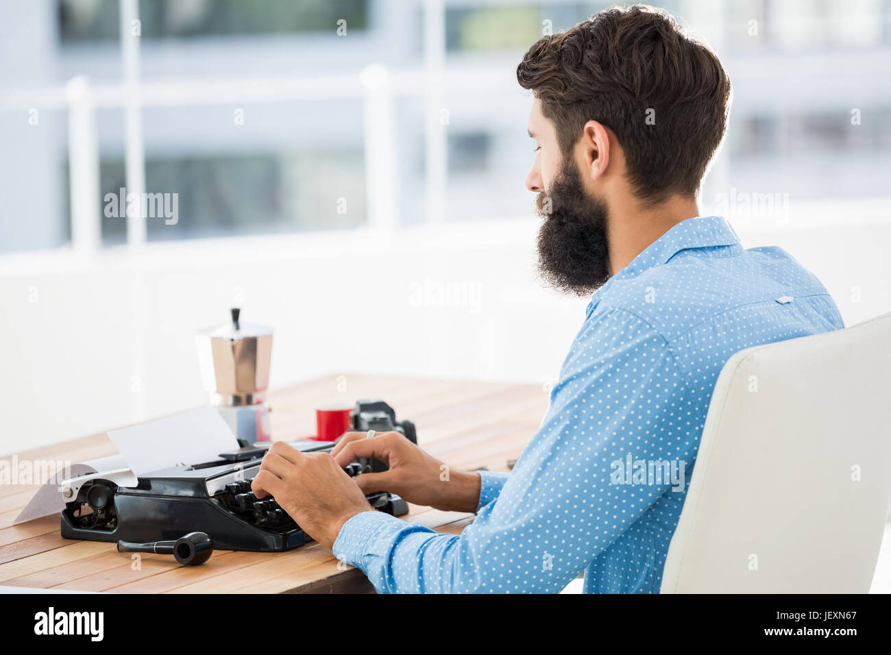 Male writer using typing machine hi-res stock photography and images ...