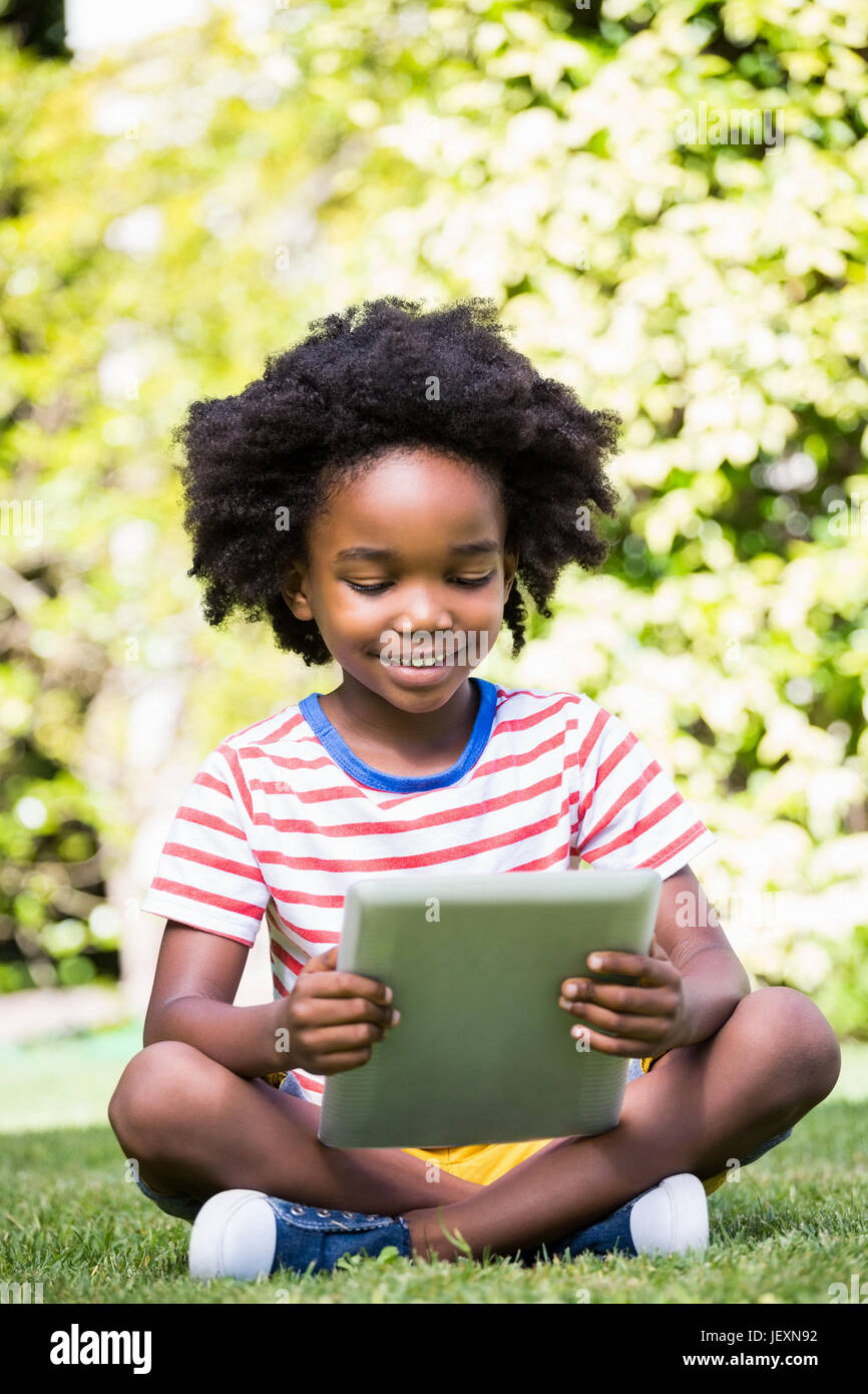 Boy using a tablet computer Stock Photo - Alamy
