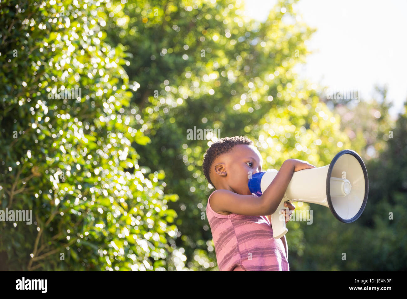 Boy using a megaphone Stock Photo - Alamy