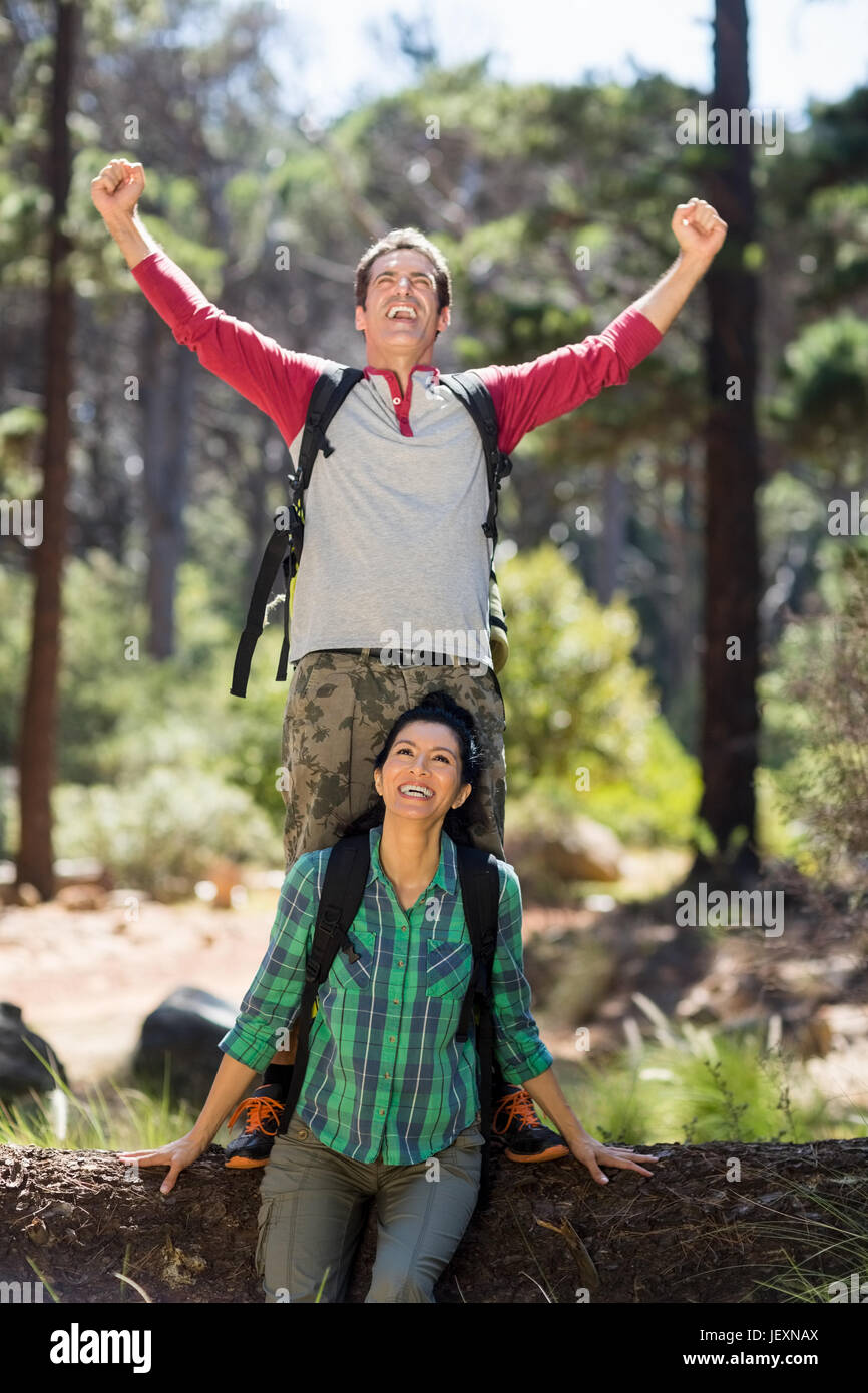 Couple smiling and throwing up arms Stock Photo - Alamy