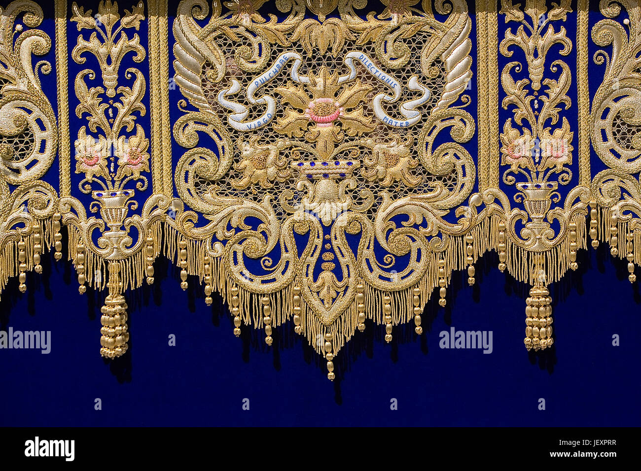 Embroidery thread of gold on blue velvet, Spain Stock Photo - Alamy