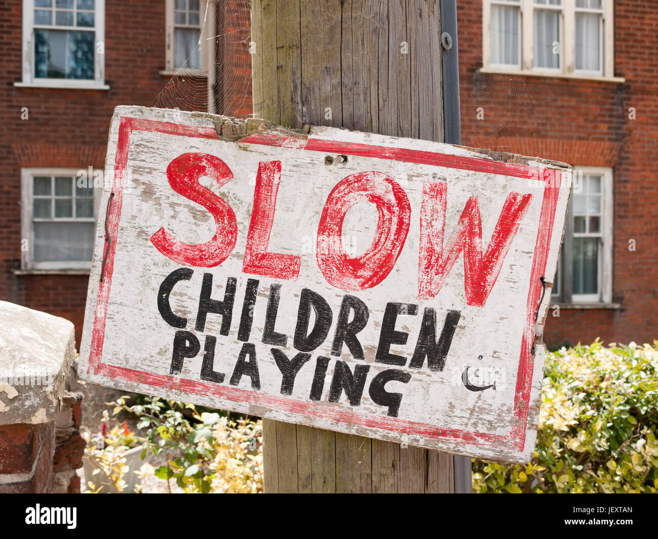 handmade unique red, black and white slow children playing sign on post ...