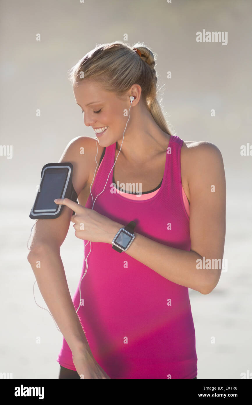 Woman listening music on mobile phone Stock Photo - Alamy
