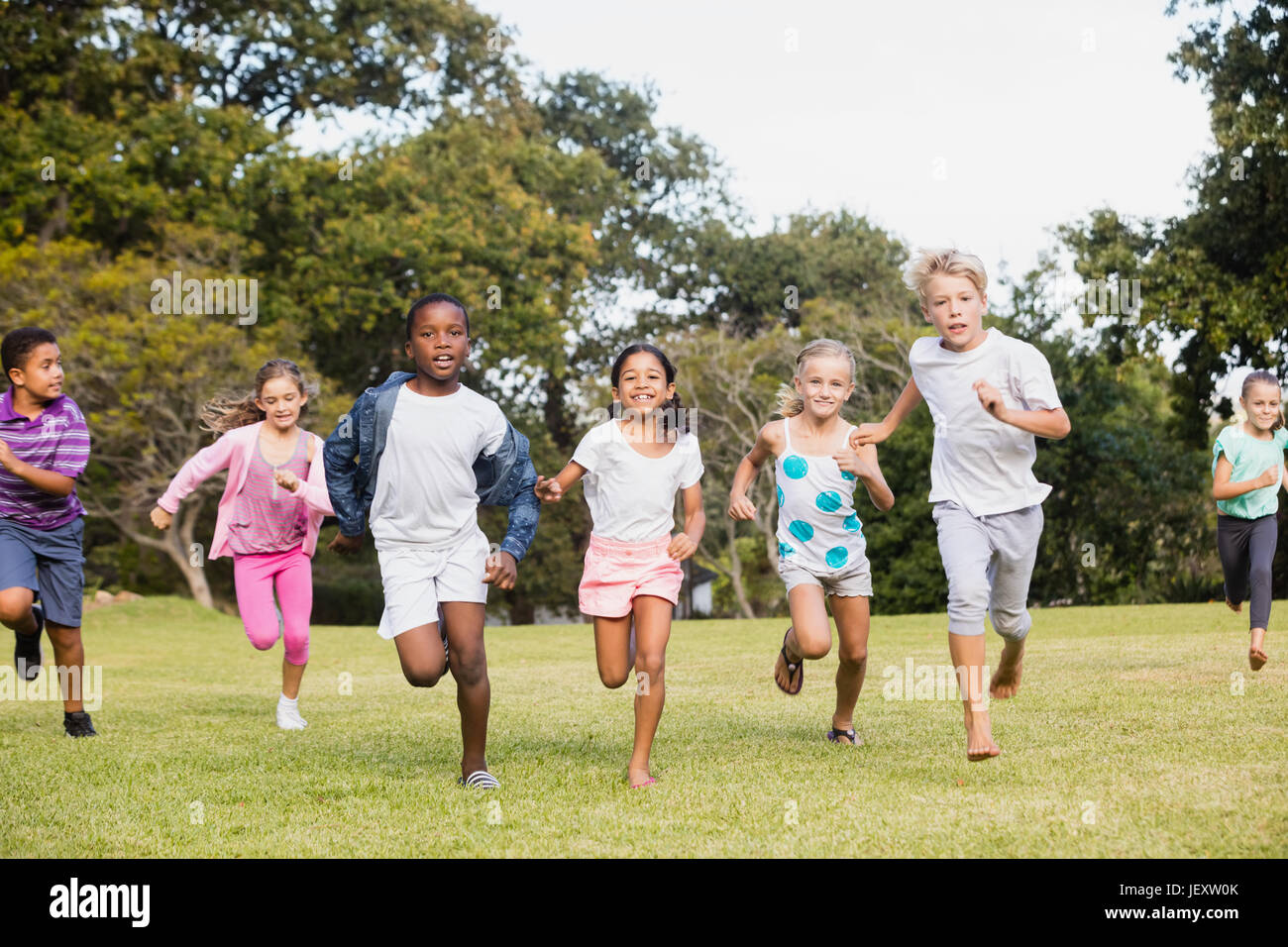 Kids playing together during a sunny day Stock Photo - Alamy