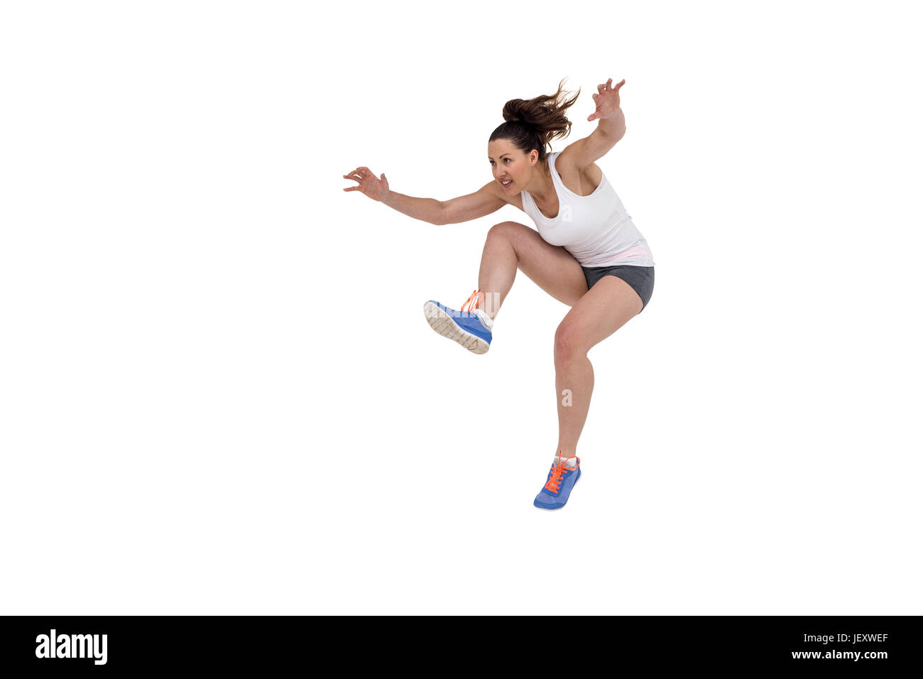 Athletic woman running on white background Stock Photo - Alamy