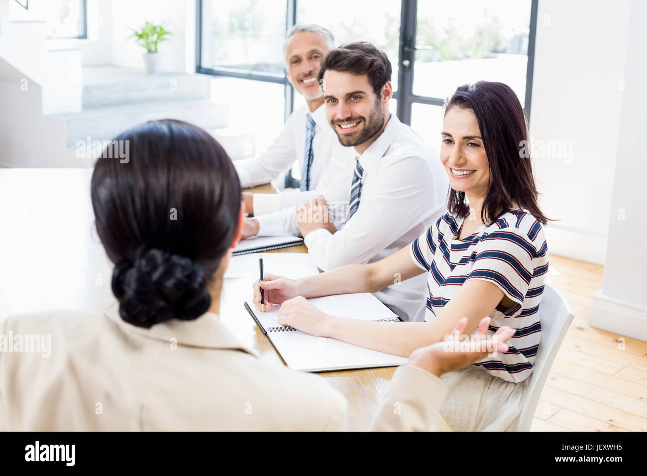 Business colleagues discussing in a meeting Stock Photo - Alamy