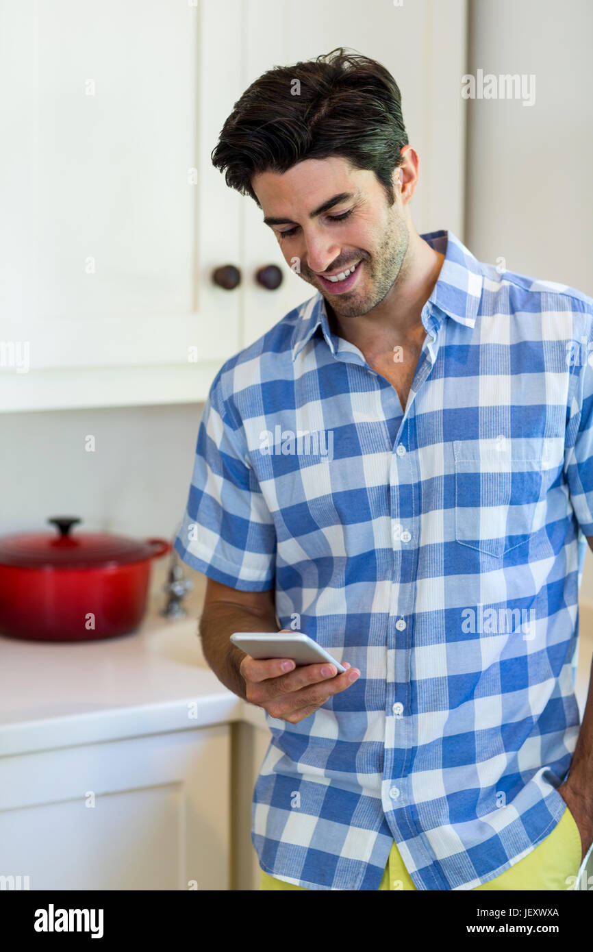 Young man text messaging on mobile Stock Photo - Alamy