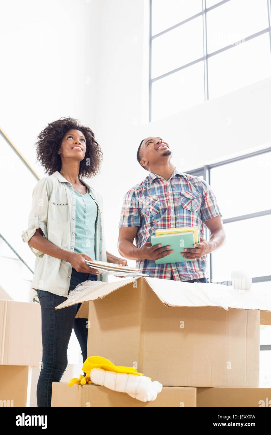 Young couple unpacking carton boxes Stock Photo - Alamy