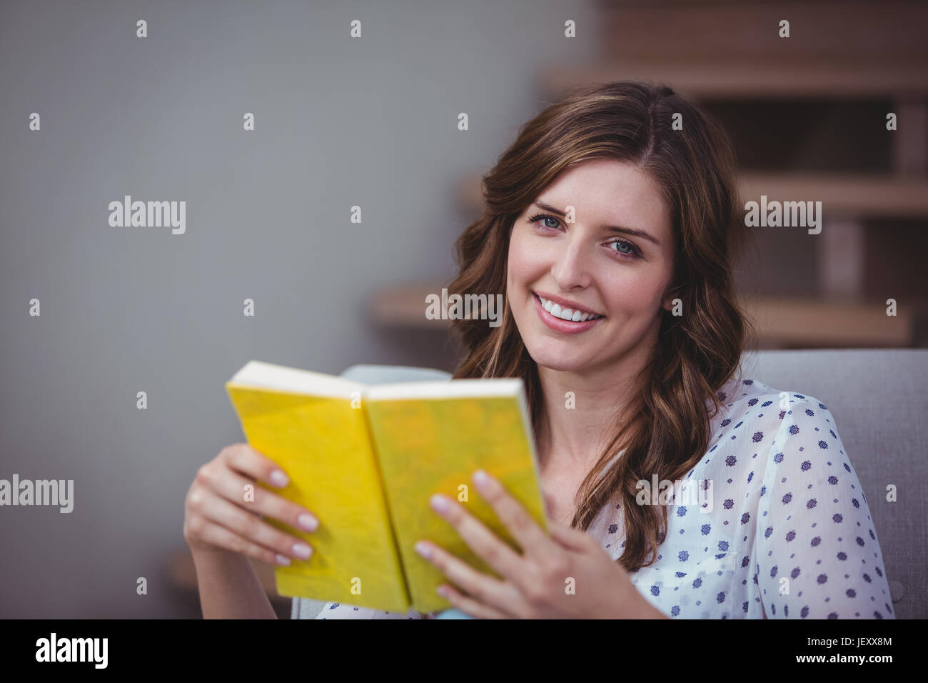 Beautiful woman reading a book Stock Photo - Alamy