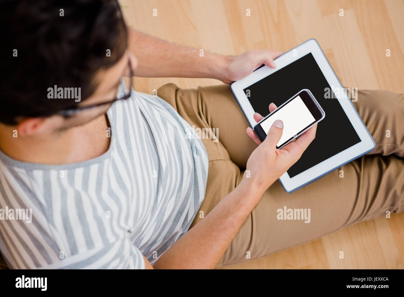 Man using his mobile phone Stock Photo - Alamy