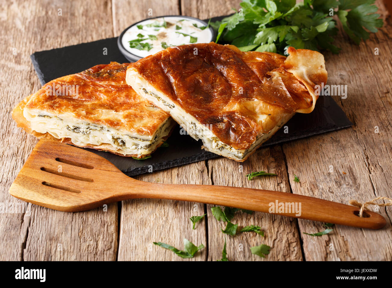 Delicious snack: Balkan burek with spinach and cheese close-up on the ...