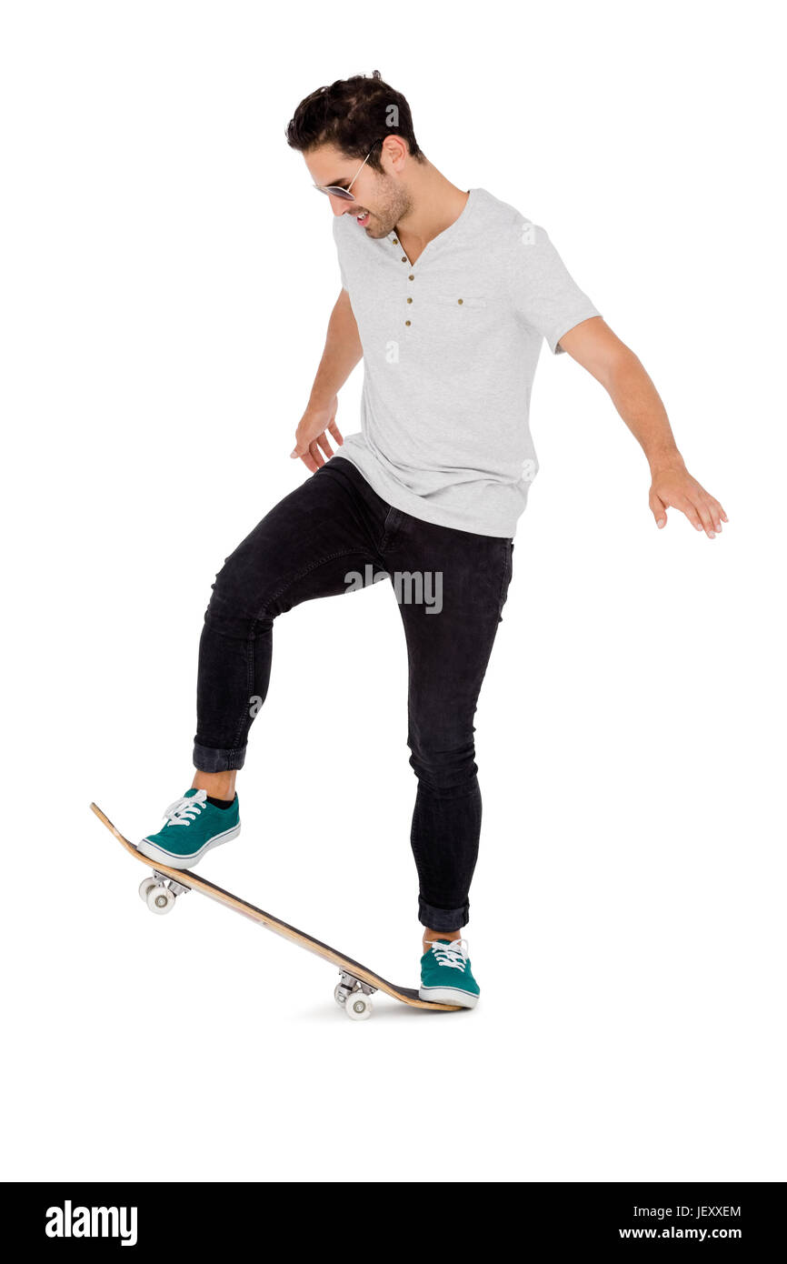 Young man skateboarding Stock Photo - Alamy