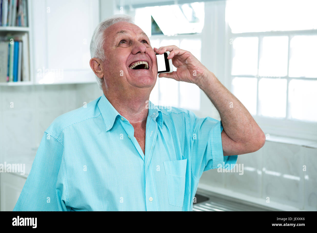 Happy senior man calling on hi-res stock photography and images - Alamy