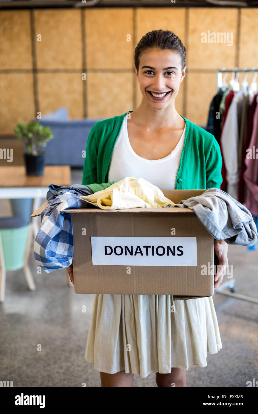 Young woman with donation box Stock Photo - Alamy