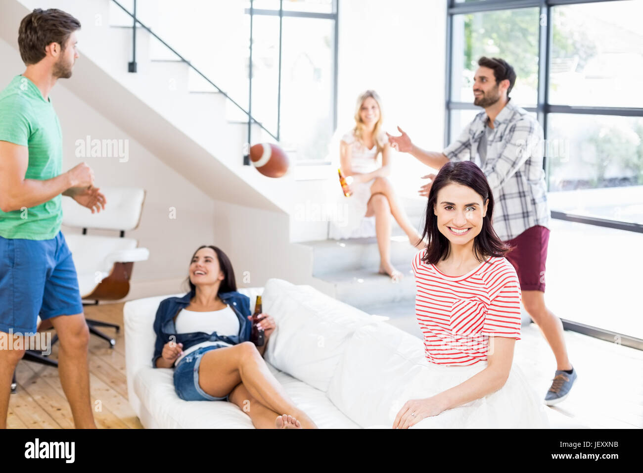 Playful friends having fun together Stock Photo - Alamy