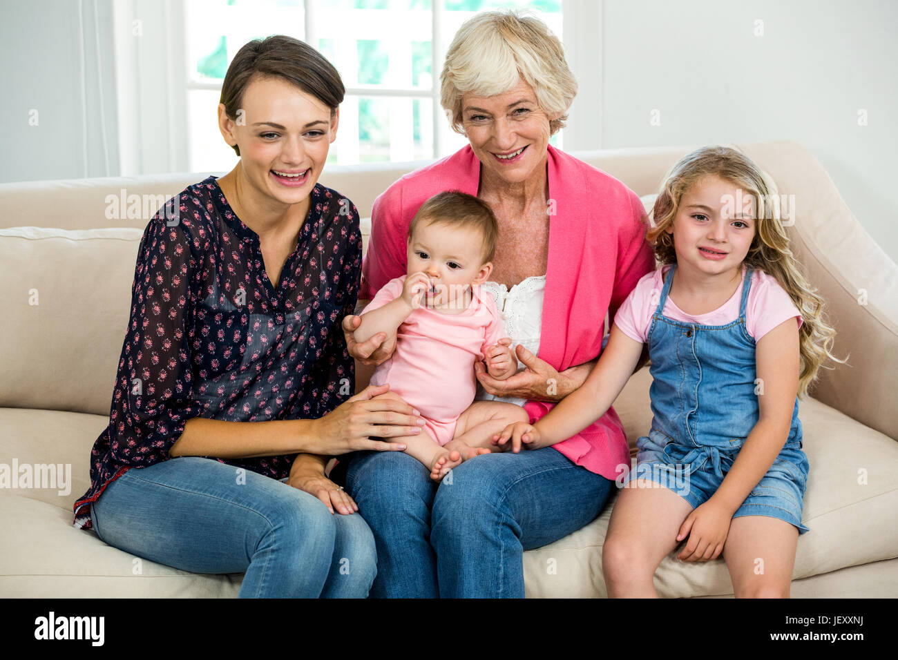 Smiling multi generation family with baby Stock Photo - Alamy