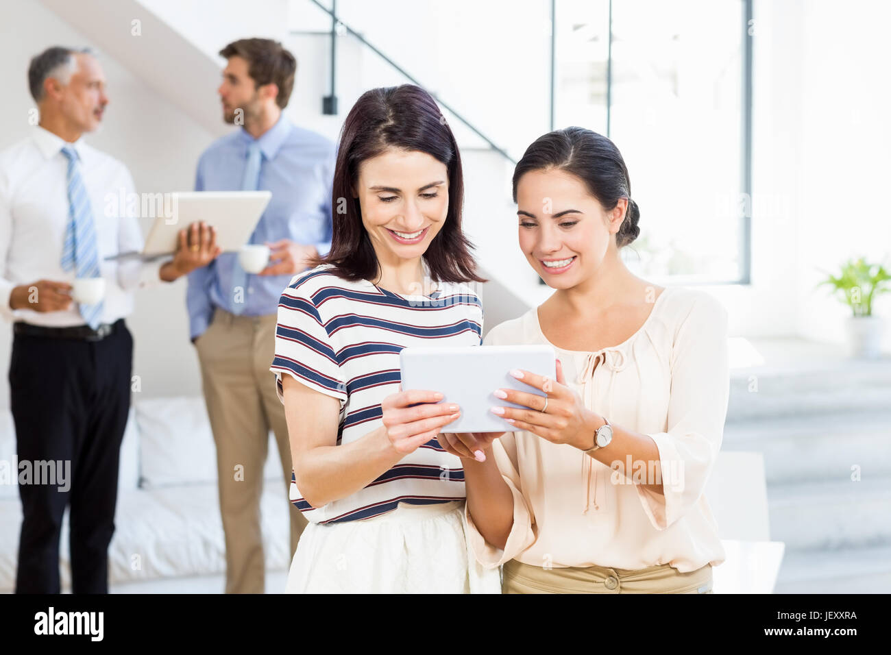 Businesswomen are looking at their notes Stock Photo - Alamy