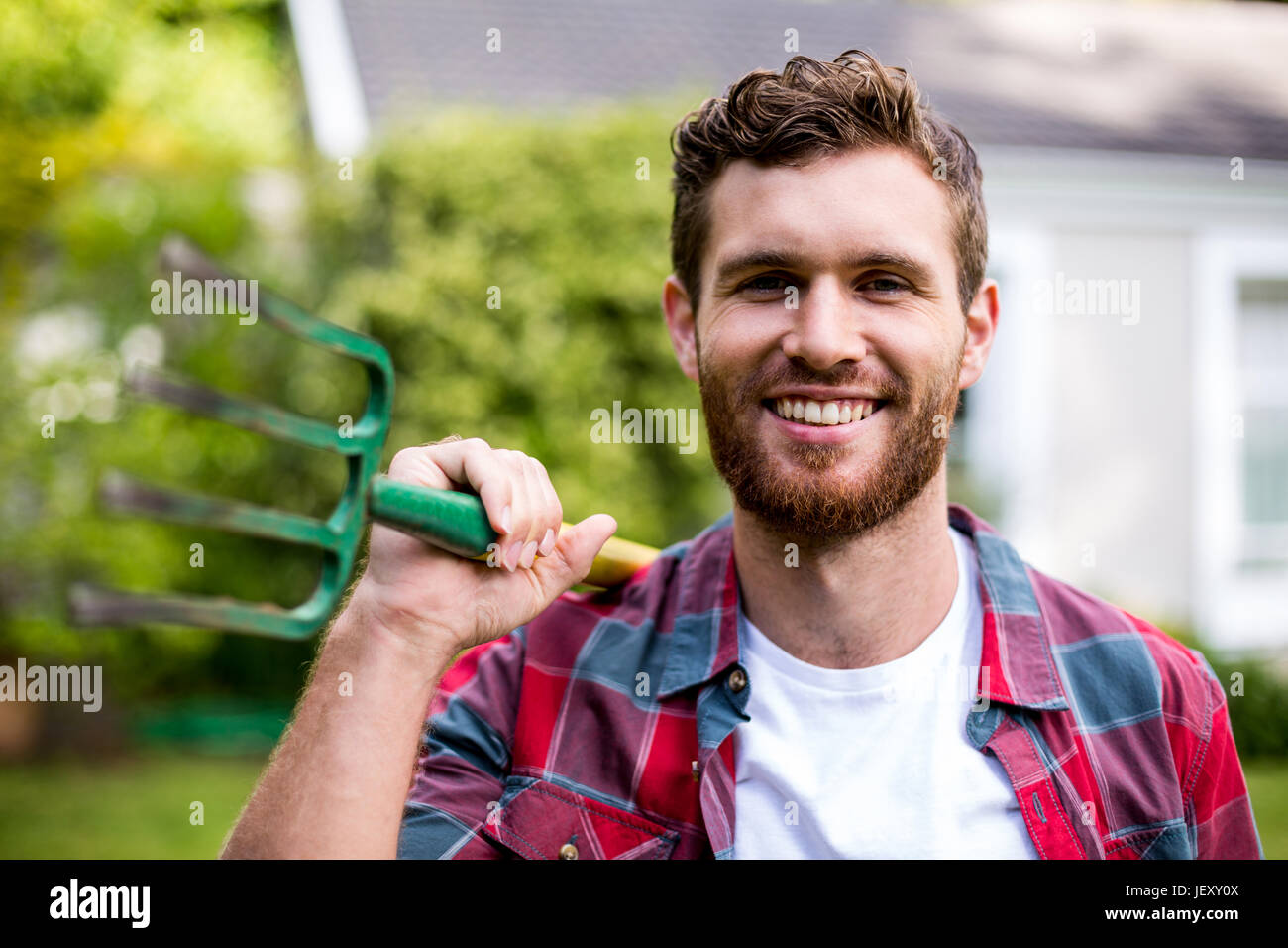 Man standing in grass rake hi-res stock photography and images - Alamy
