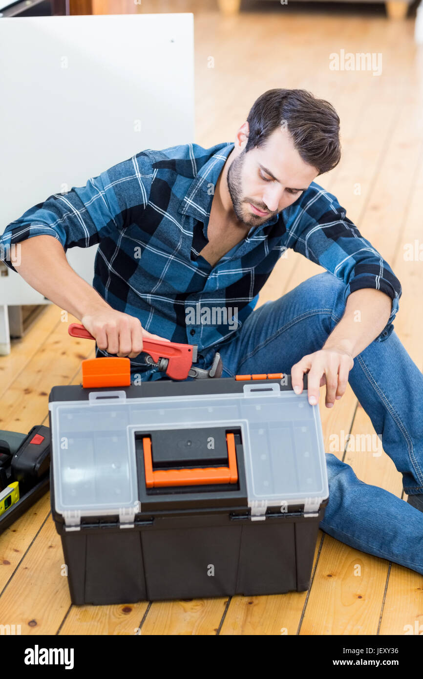 Man unpacking his tool box Stock Photo - Alamy