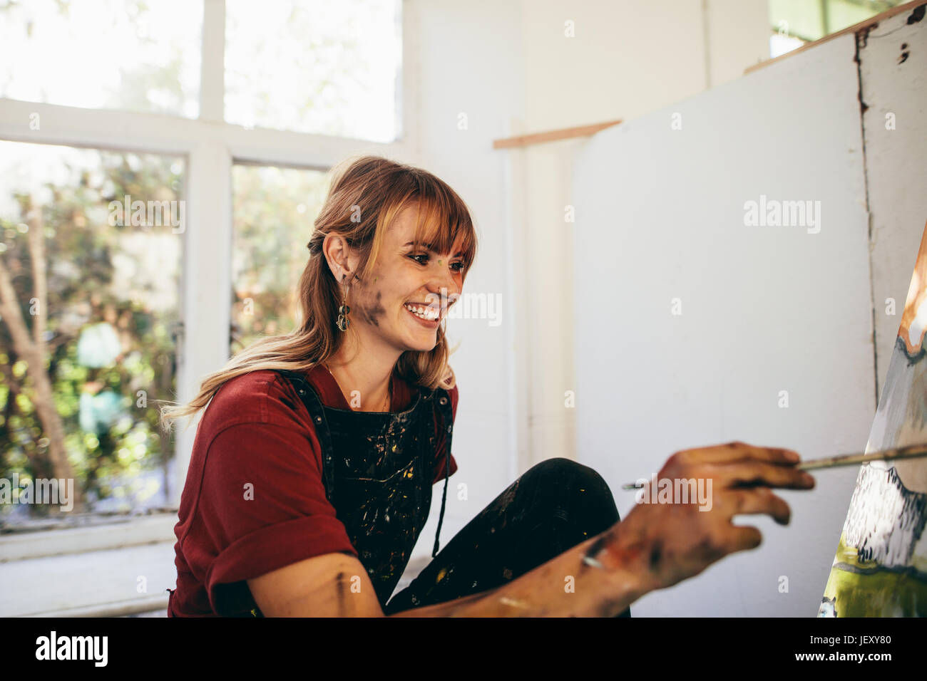 Smiling artist paintings in art hi-res stock photography and images - Alamy