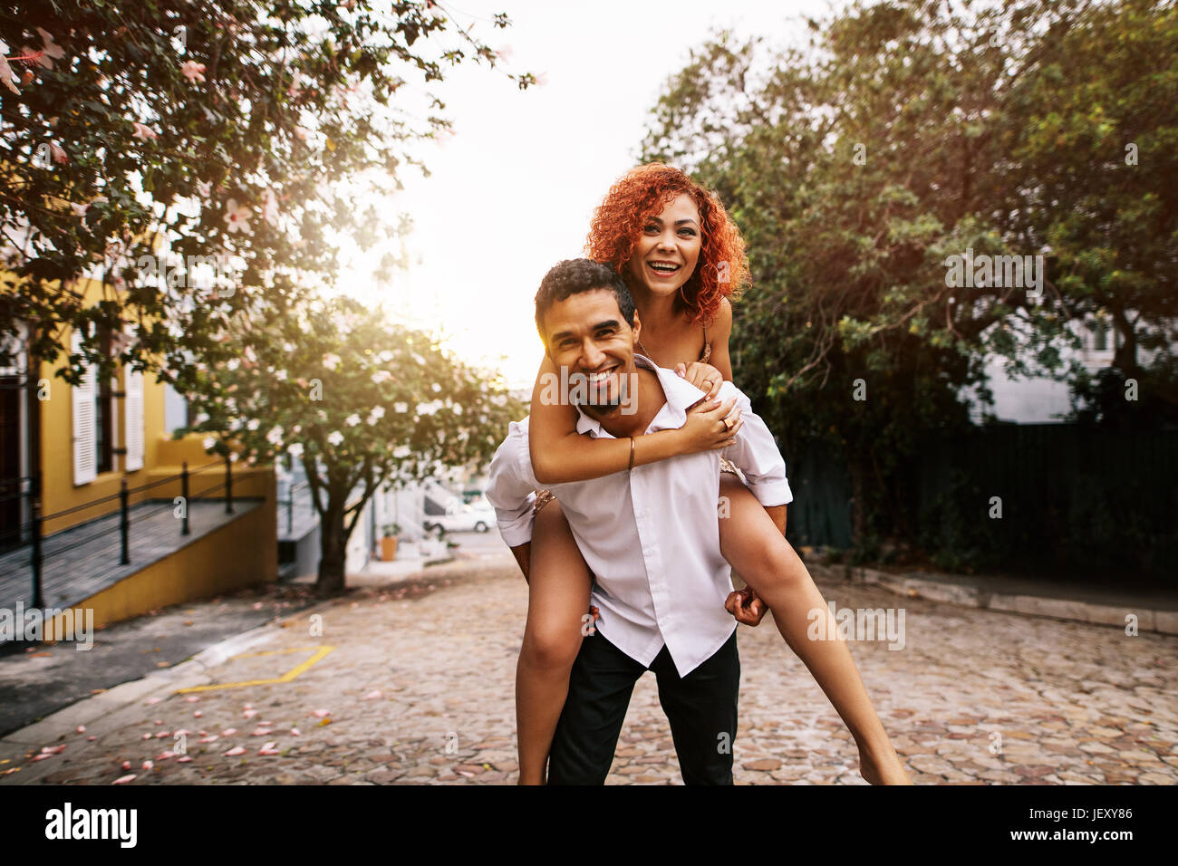 Man Carrying Girlfriend On Shoulders Stock Photos & Man Carrying ...
