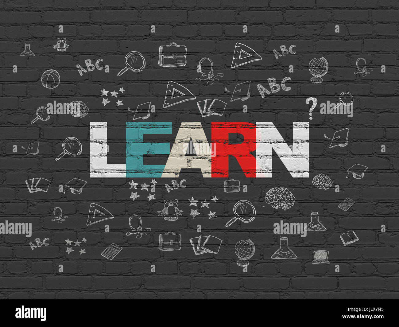 Studying concept: Learn on wall background Stock Photo - Alamy
