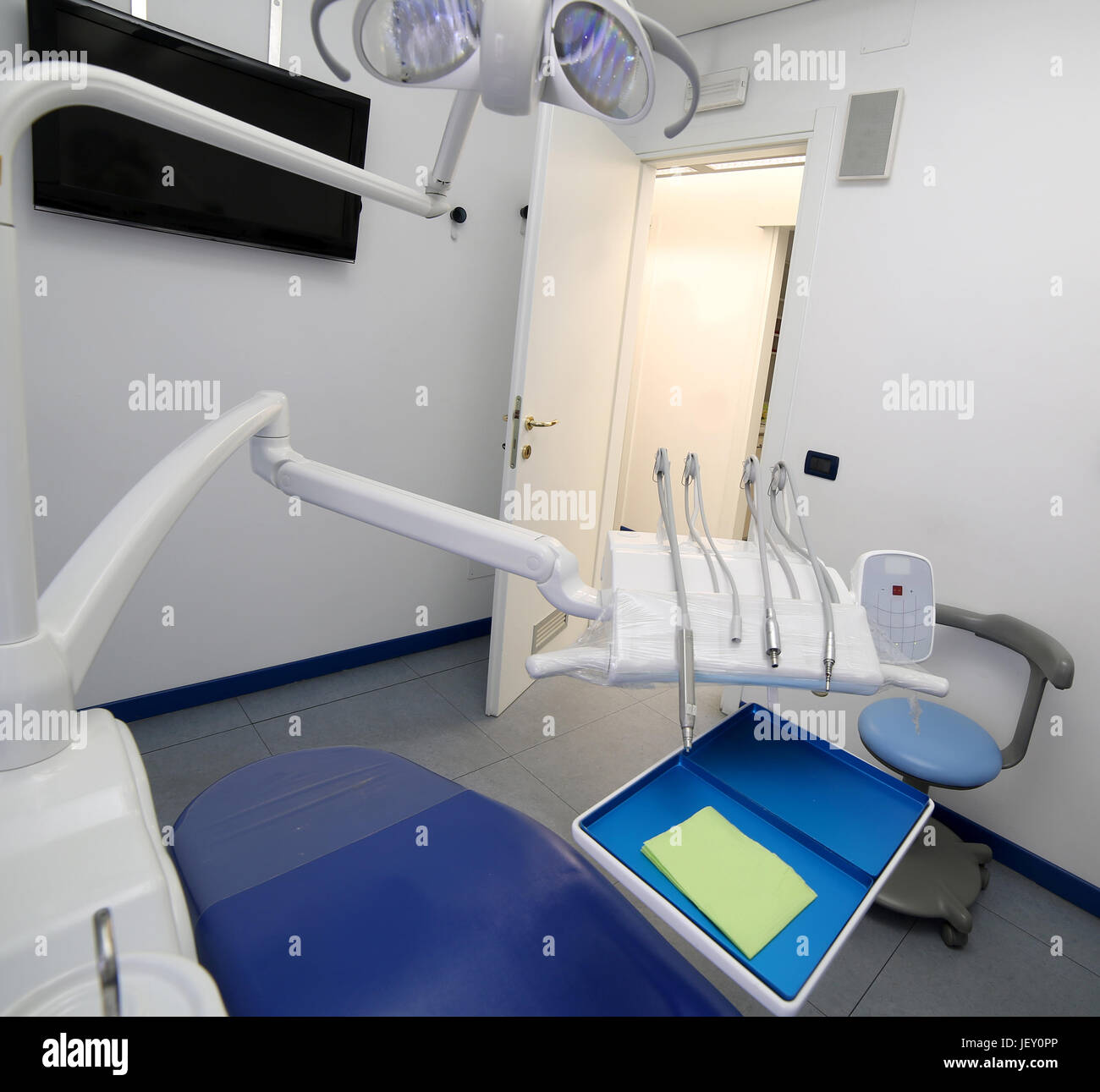 Inside a dental clinic with the large halogen light photographed with ...
