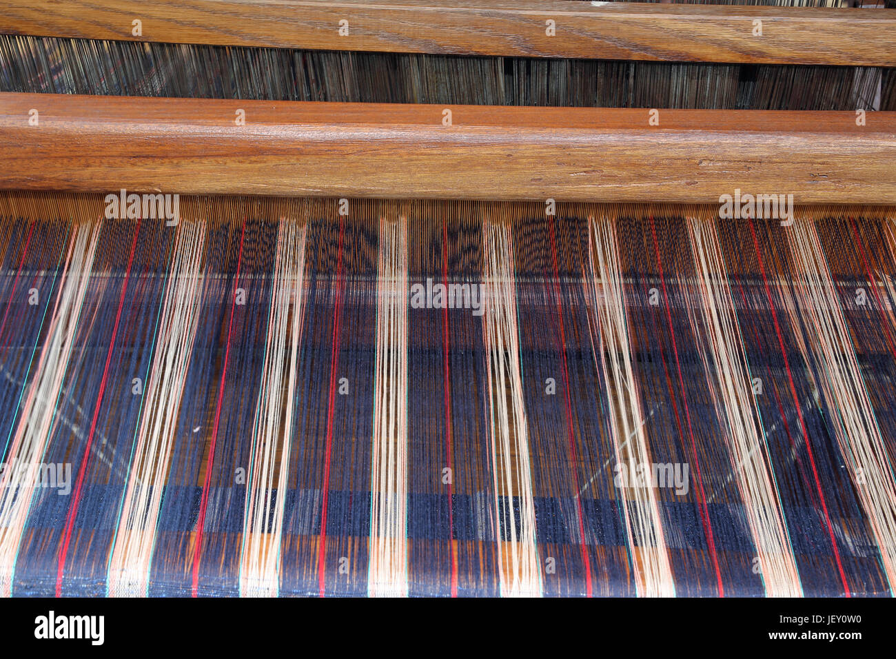 wooden Old fabric weaving frame during a historic re-enactment of old ...