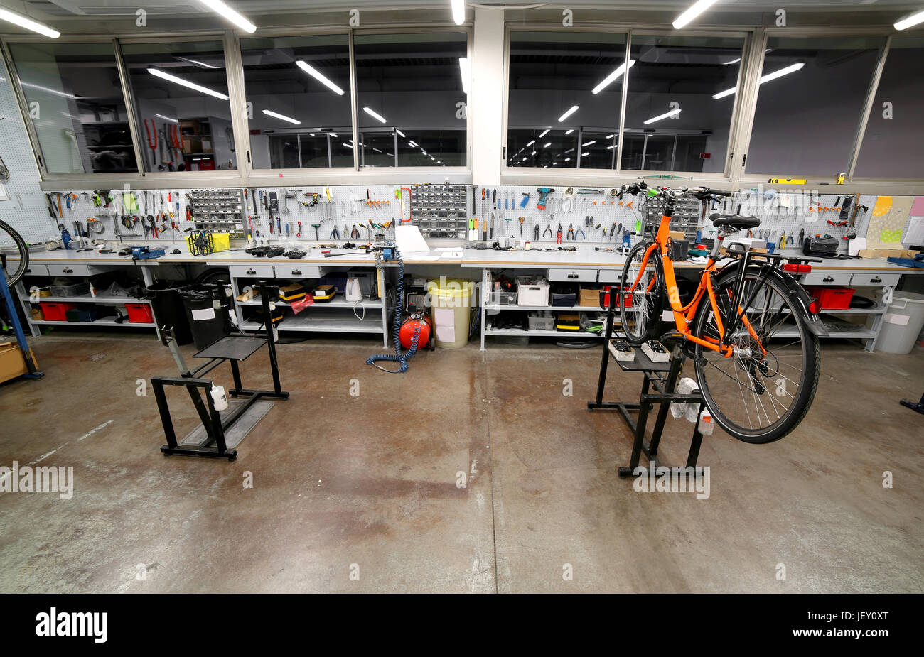Workbench with many tools inside a mechanic workshop specialized in ...