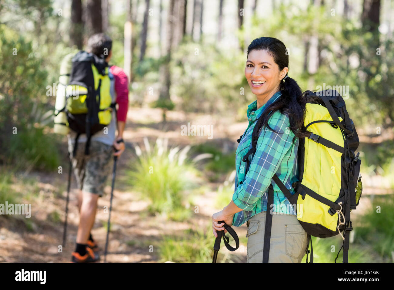 Couple front the back hiking Stock Photo - Alamy