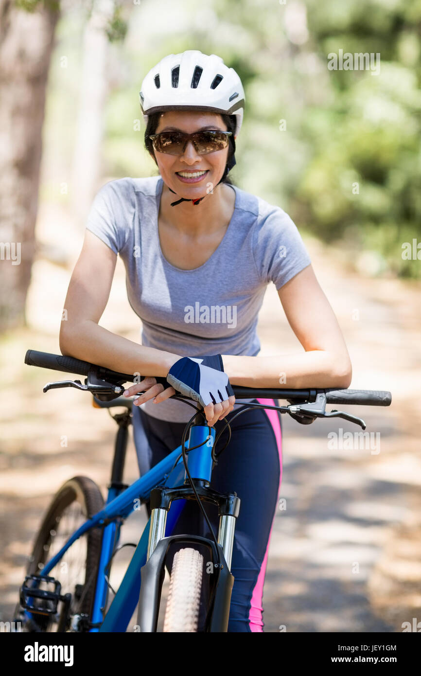 Smiling female posing bicycle hi-res stock photography and images - Alamy