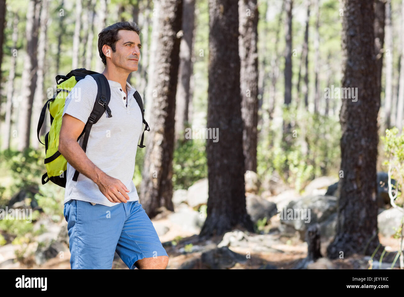 Side view of a man hiking Stock Photo - Alamy