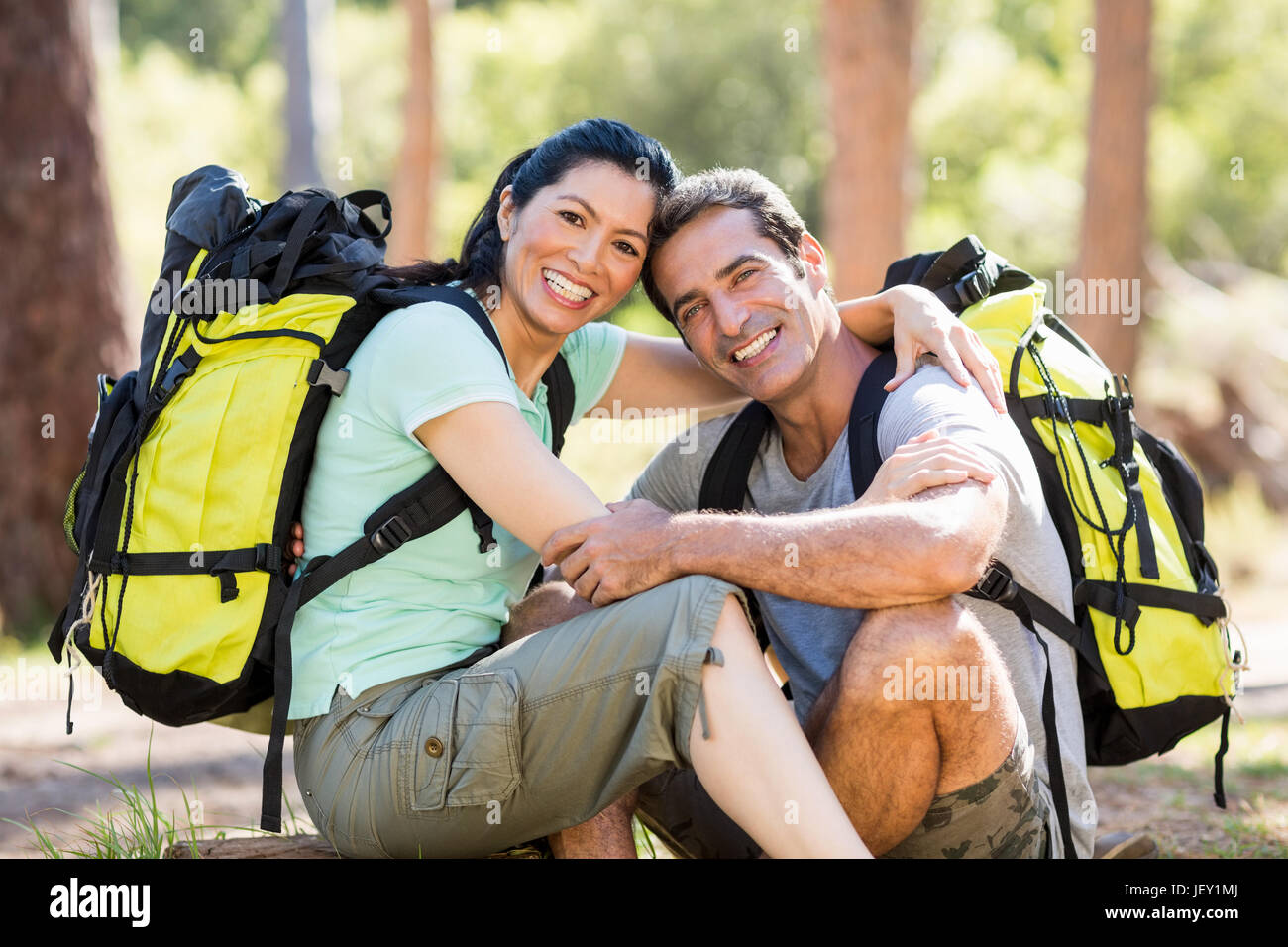 Couple sitting and holding each other Stock Photo - Alamy