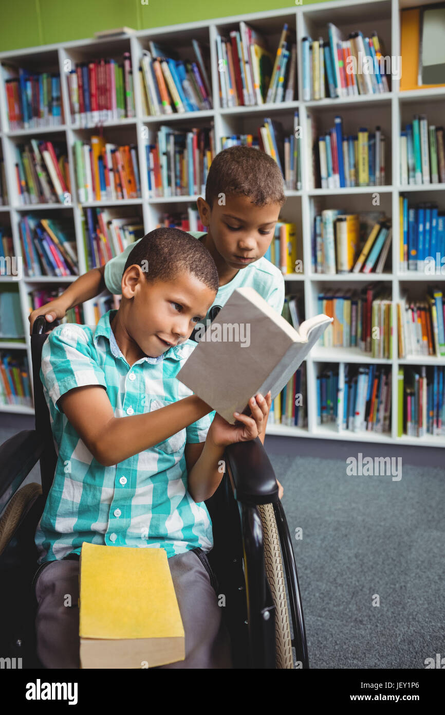 Little boys reading a book Stock Photo - Alamy