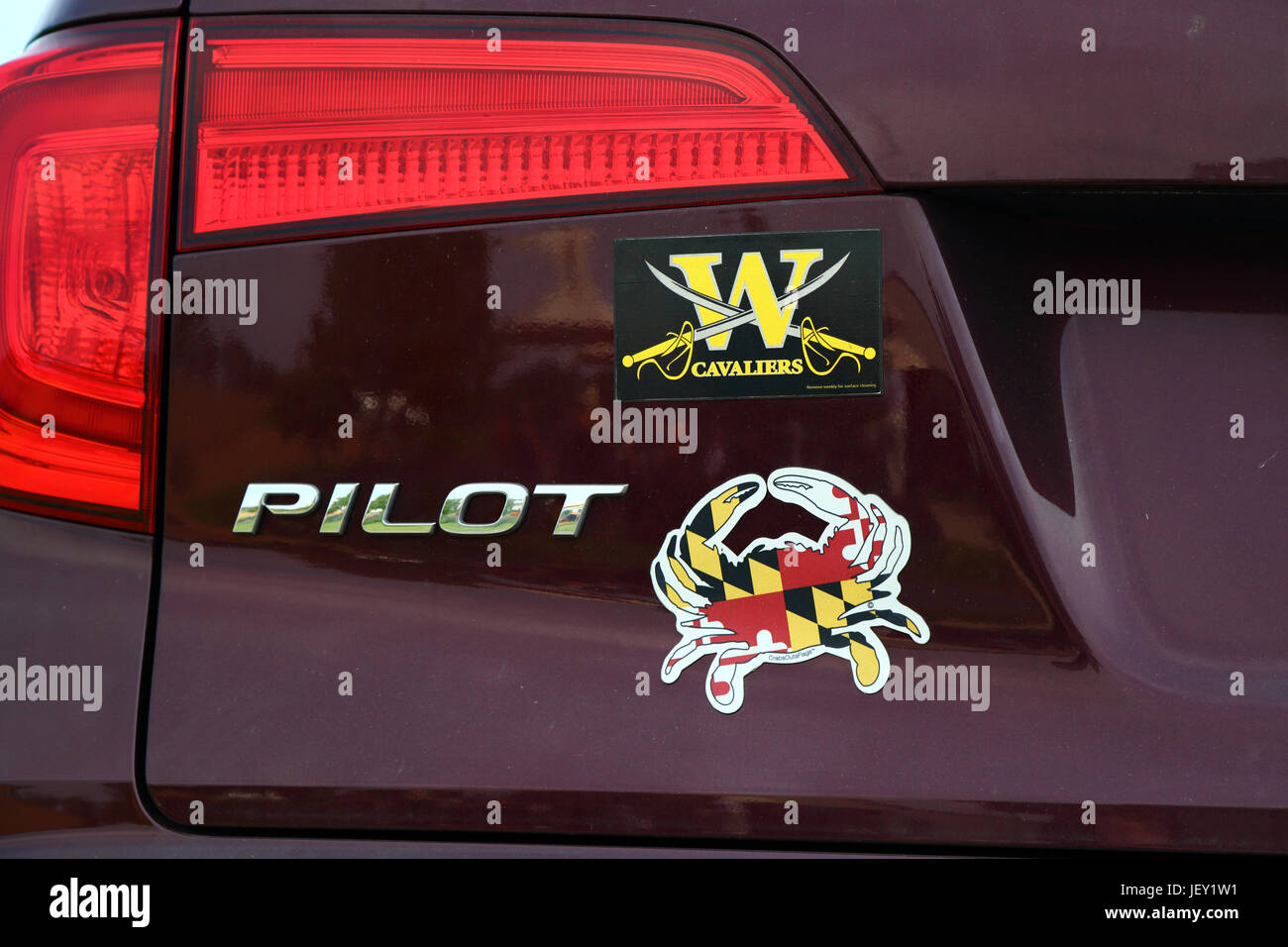 Crab shaped car sticker with Maryland state flag next to brake light on ...