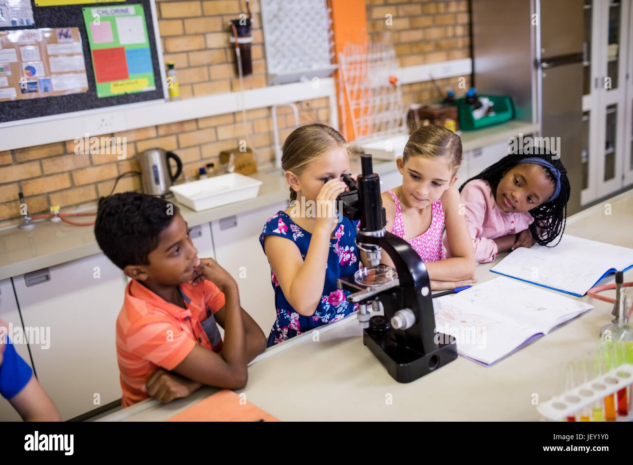 Cute school girl microscope in hi-res stock photography and images - Alamy