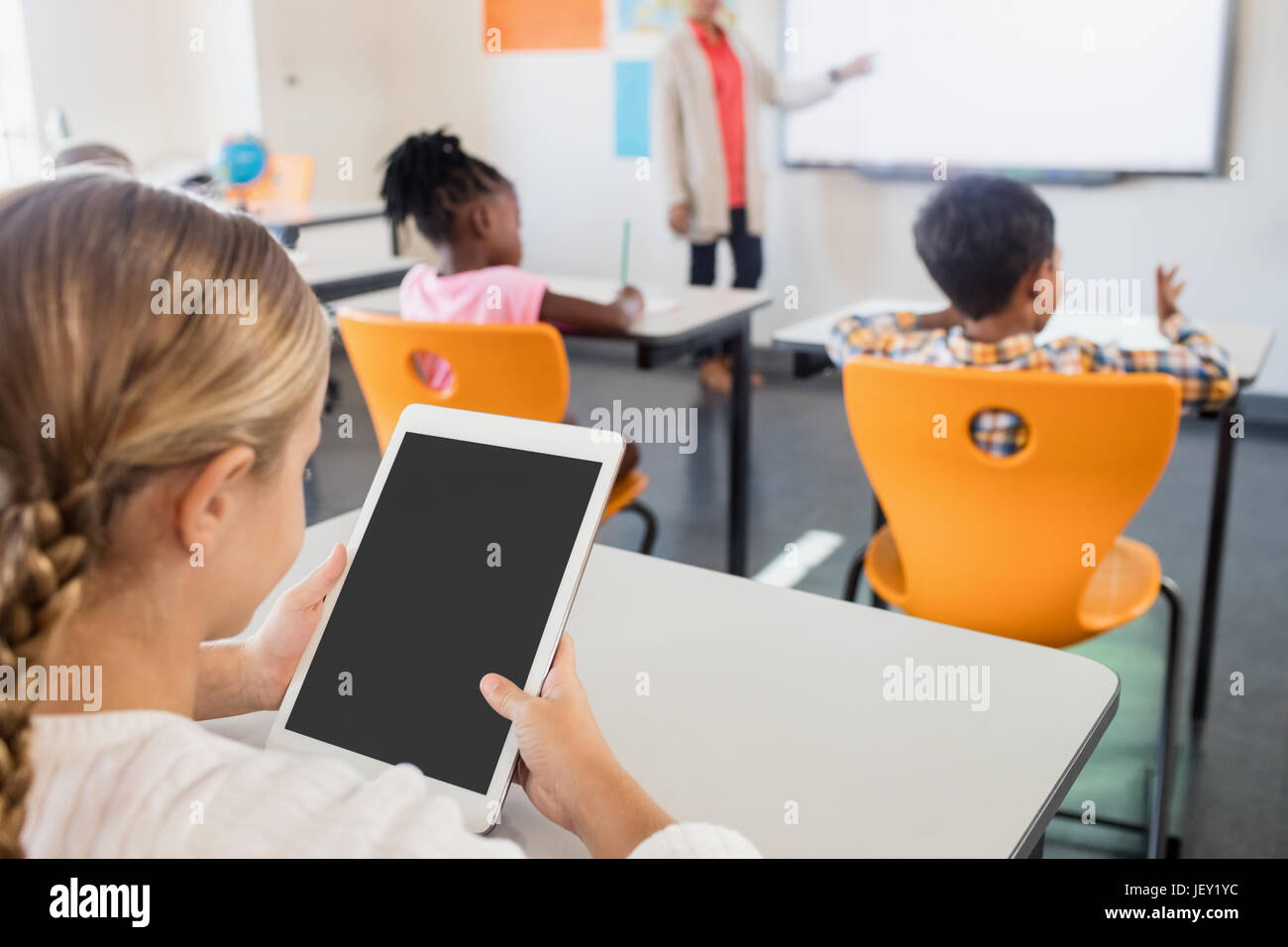 Children teacher teaching class serious hi-res stock photography and ...