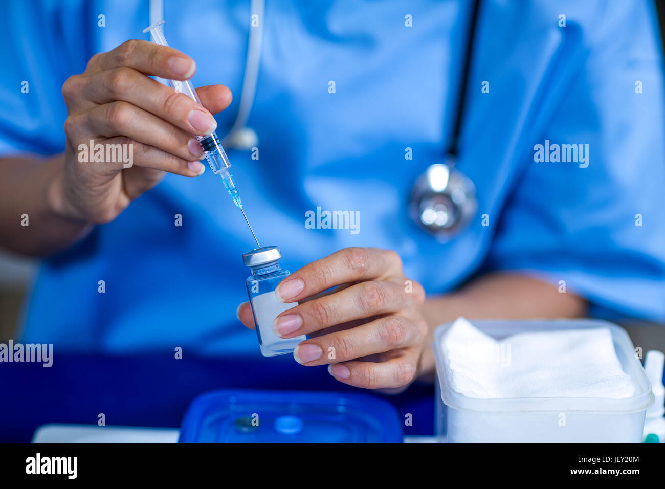 Close up of woman holding syringe Stock Photo - Alamy