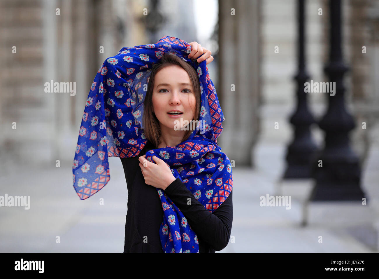 Beautiful Asian woman with a blue headscarf Stock Photo - Alamy