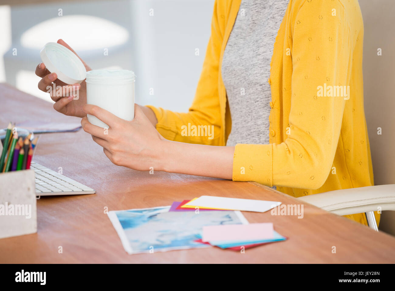 A woman is opening a box Stock Photo - Alamy