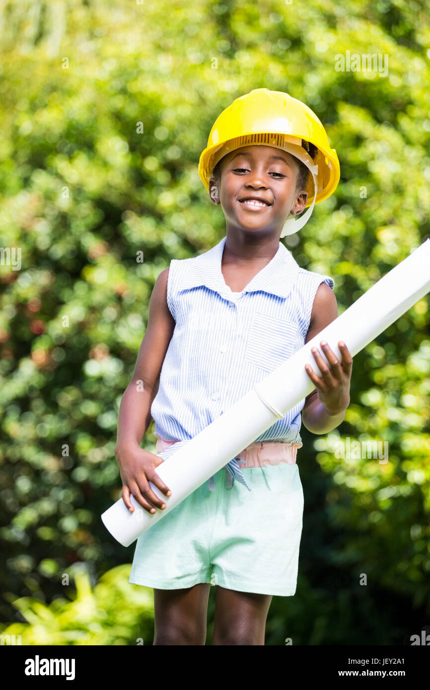 Cute mixed-race girl wearing handyman clothes Stock Photo - Alamy