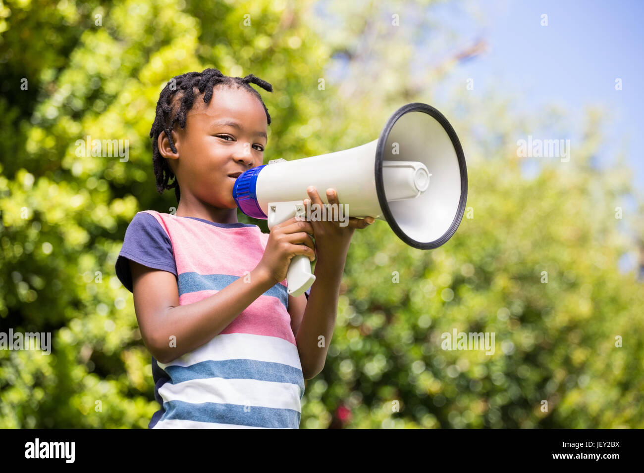 Boy using a megaphone Stock Photo - Alamy