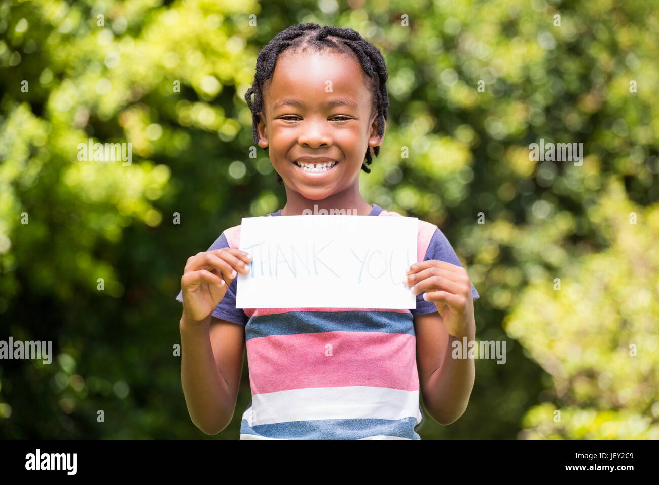 Smiling boy holding a poster Stock Photo - Alamy