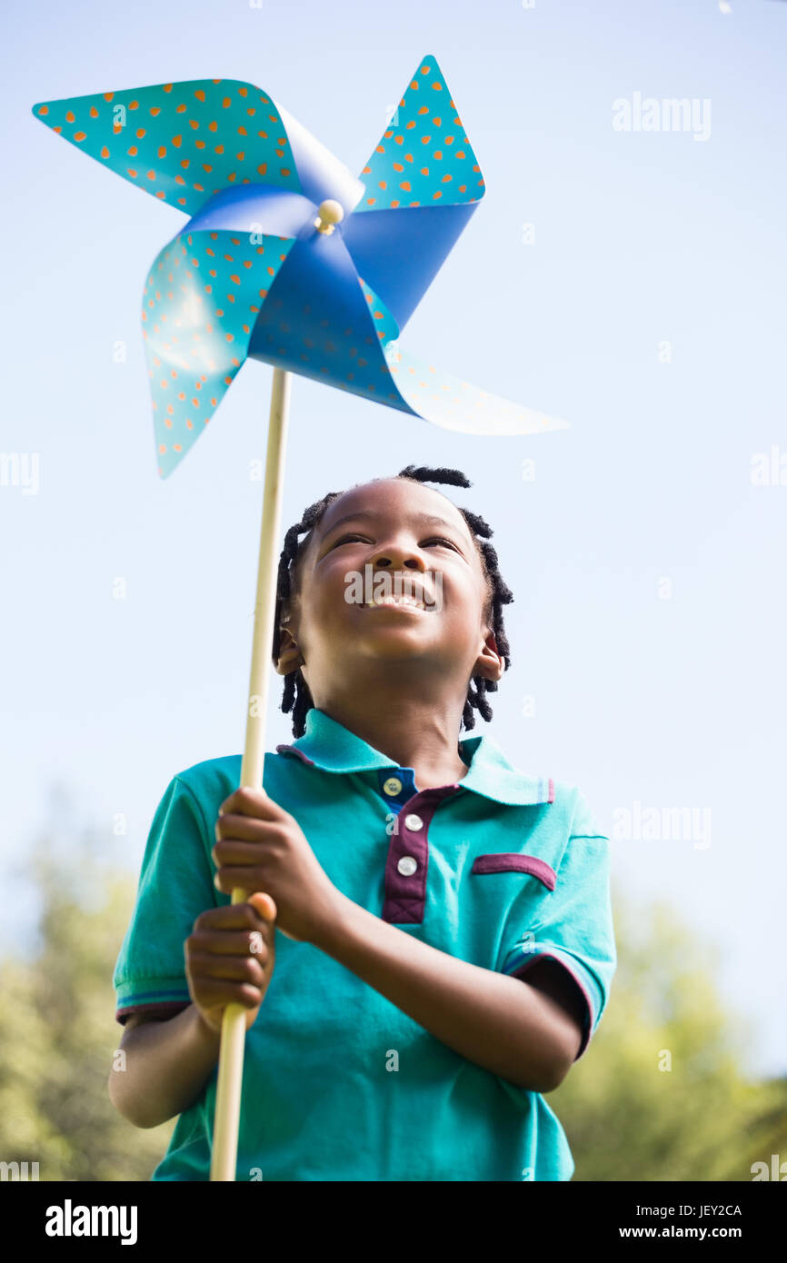 Smiling boy holding a toy Stock Photo - Alamy