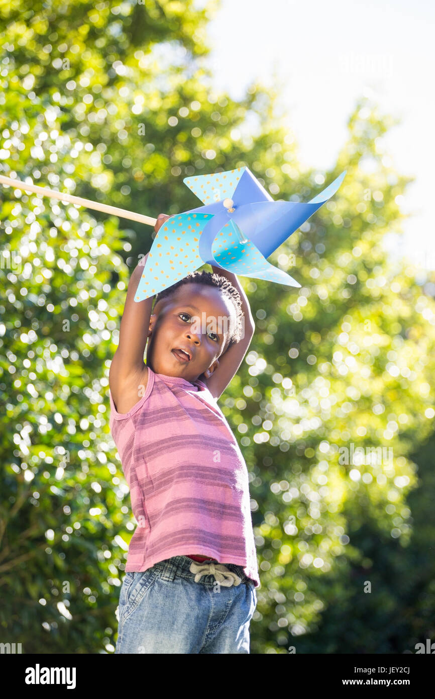 Boy playing with a pinwheel Stock Photo - Alamy