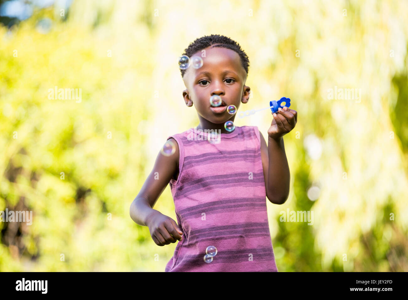 Boy playing with bubble Stock Photo - Alamy