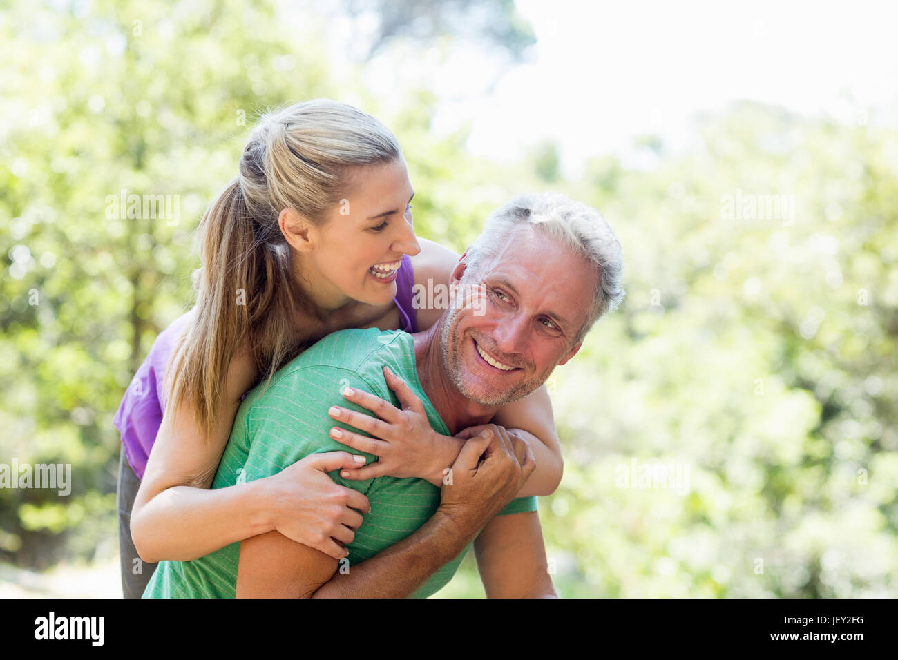 Couple smiling and holding each other Stock Photo - Alamy