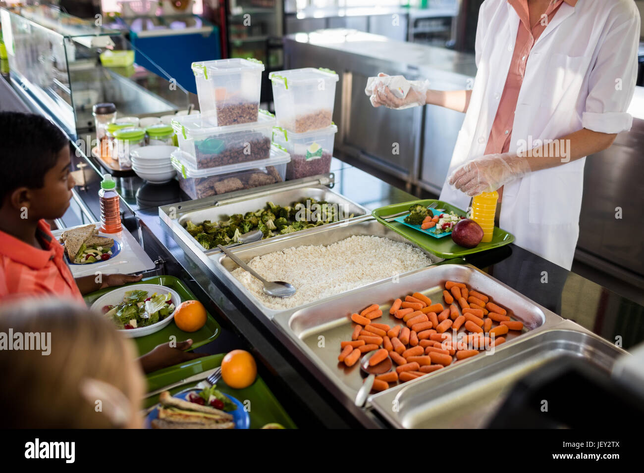 Cooker serving children Stock Photo - Alamy